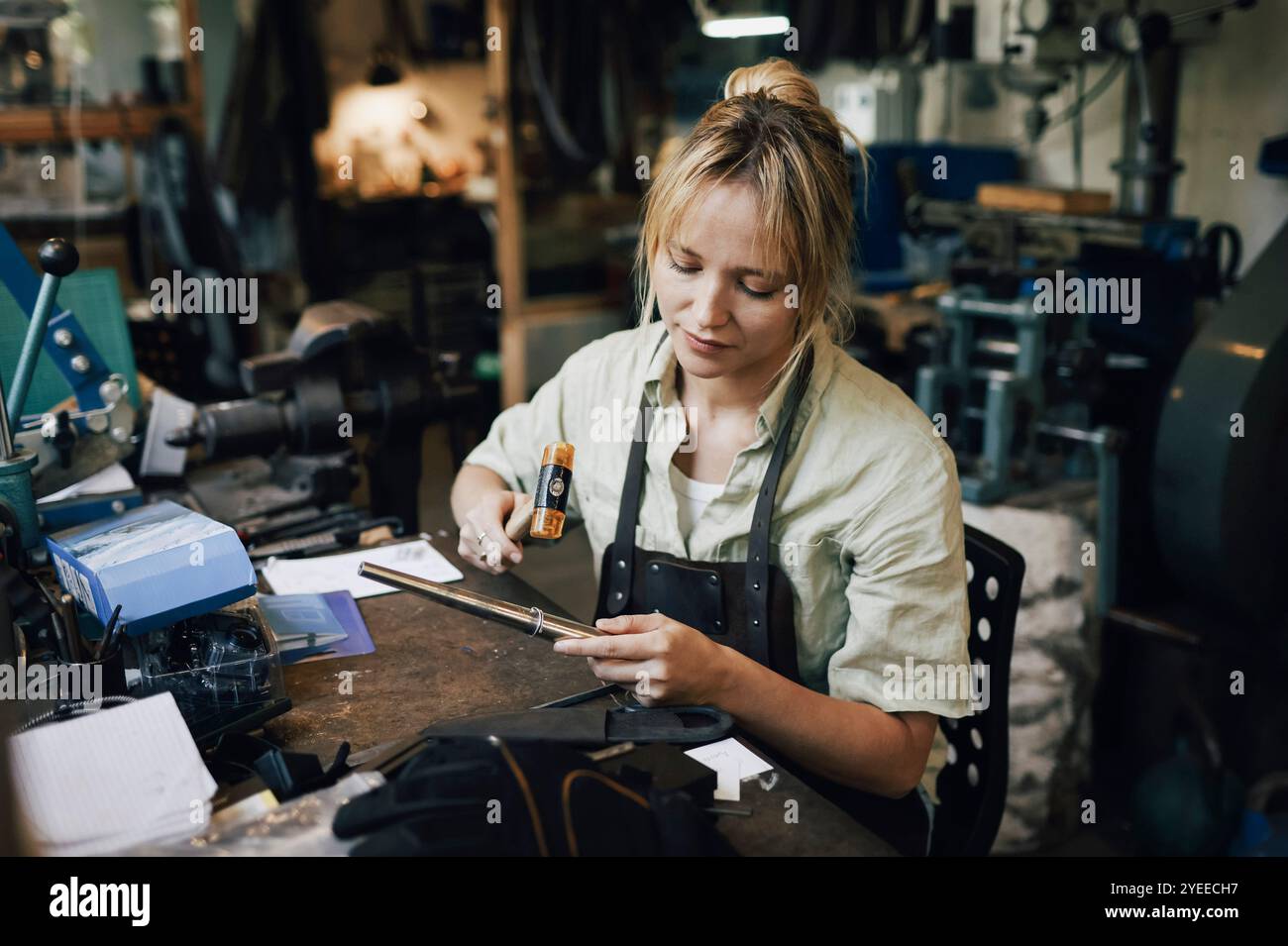 Female craftsperson making jewelry at workshop Stock Photo - Alamy