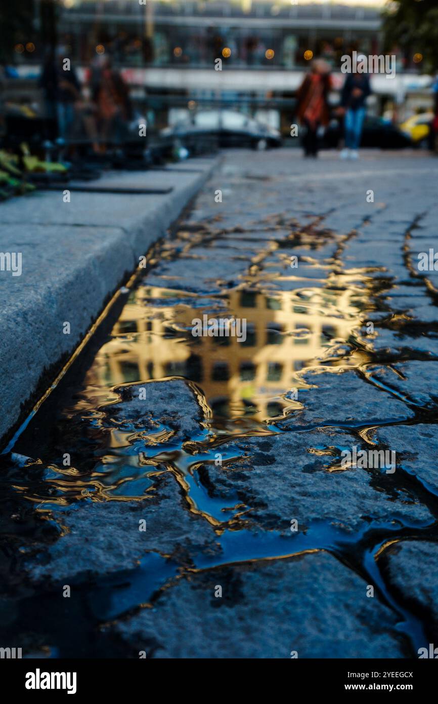 Puddle water on cobblestone hi-res stock photography and images - Alamy