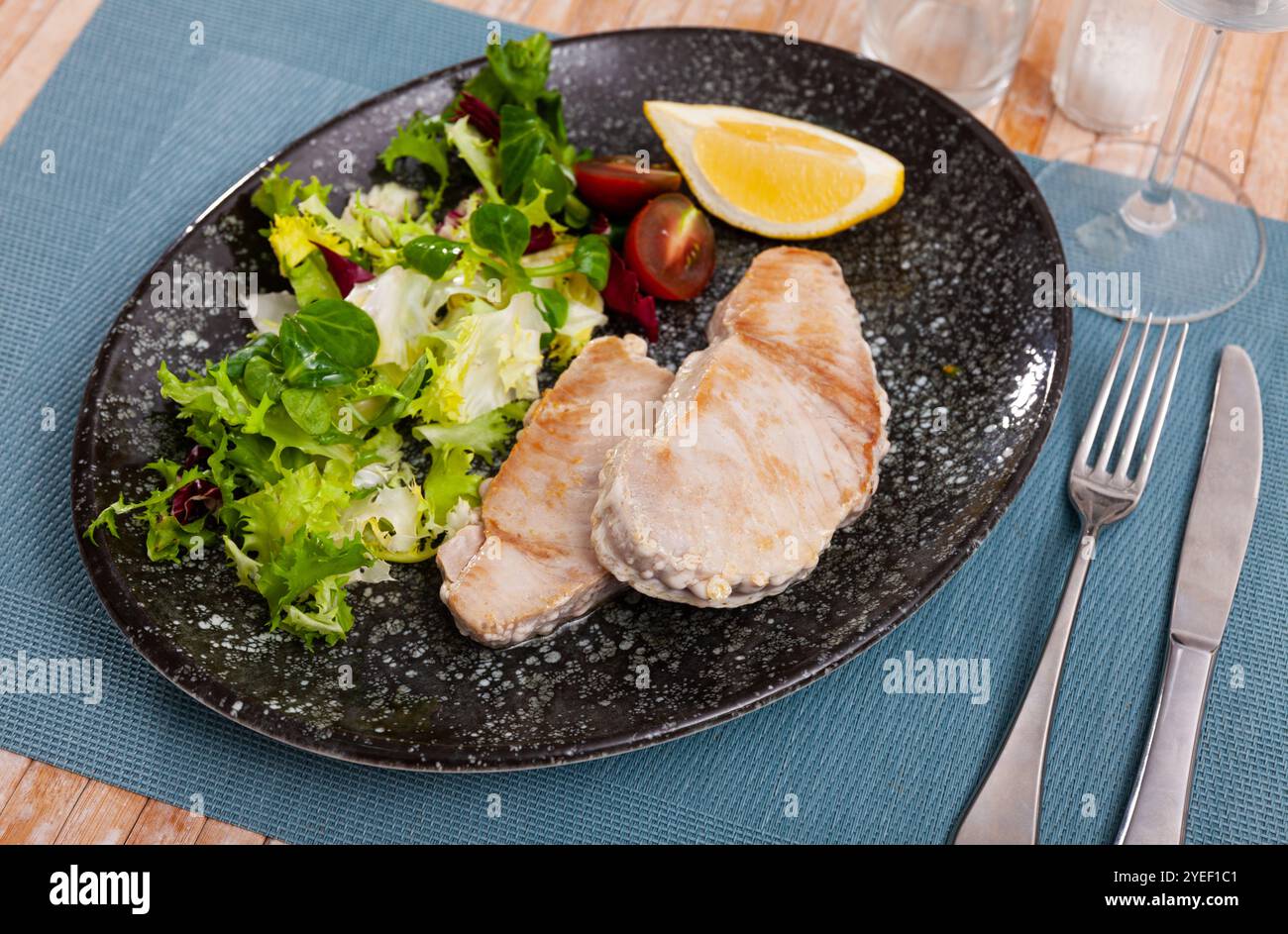 Grilled tuna fillet served with vegetable garnish Stock Photo - Alamy