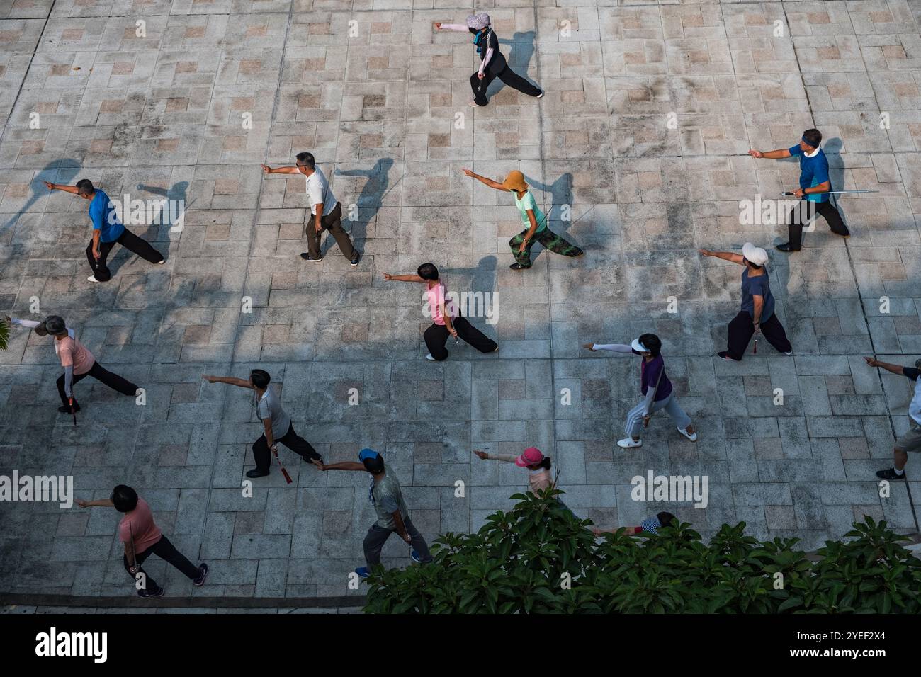 A group of people practicing Tai Chi early in the morning in Hong Kong ...