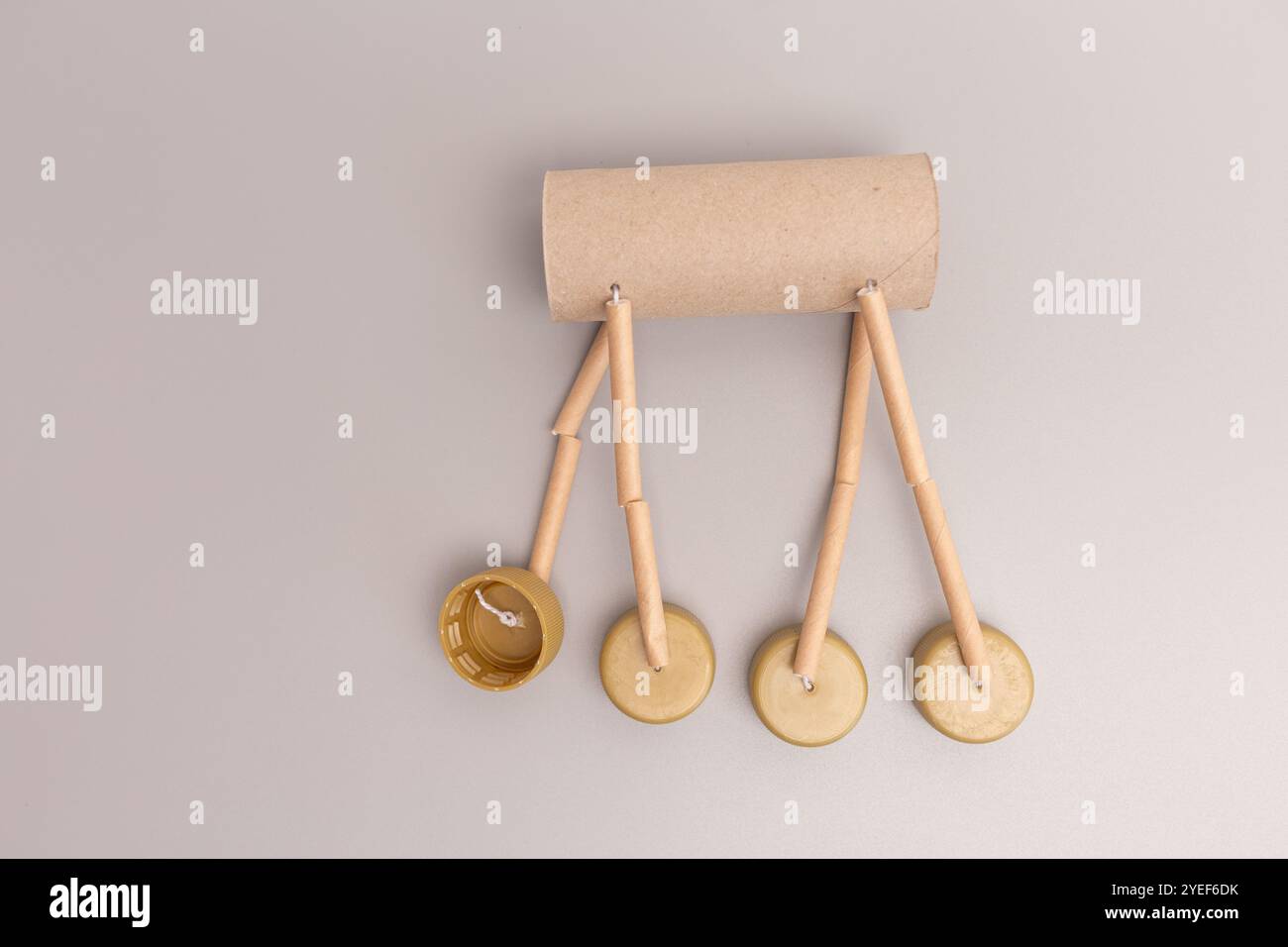 Assembling DIY reindeer puppet leg with cardboard tube string bottle ...