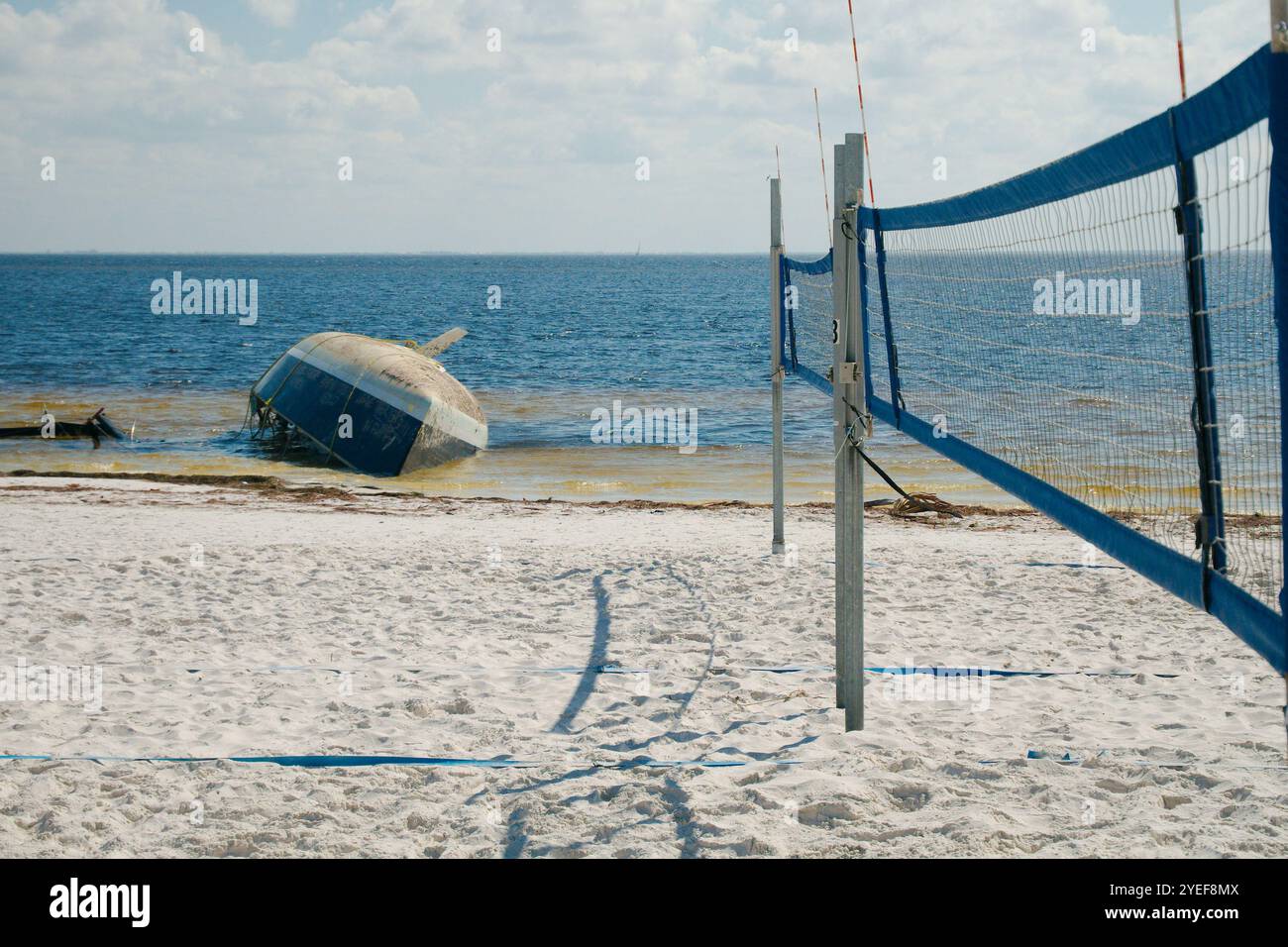 Wide view leading edge volleyball net on the right with a view out to a ...