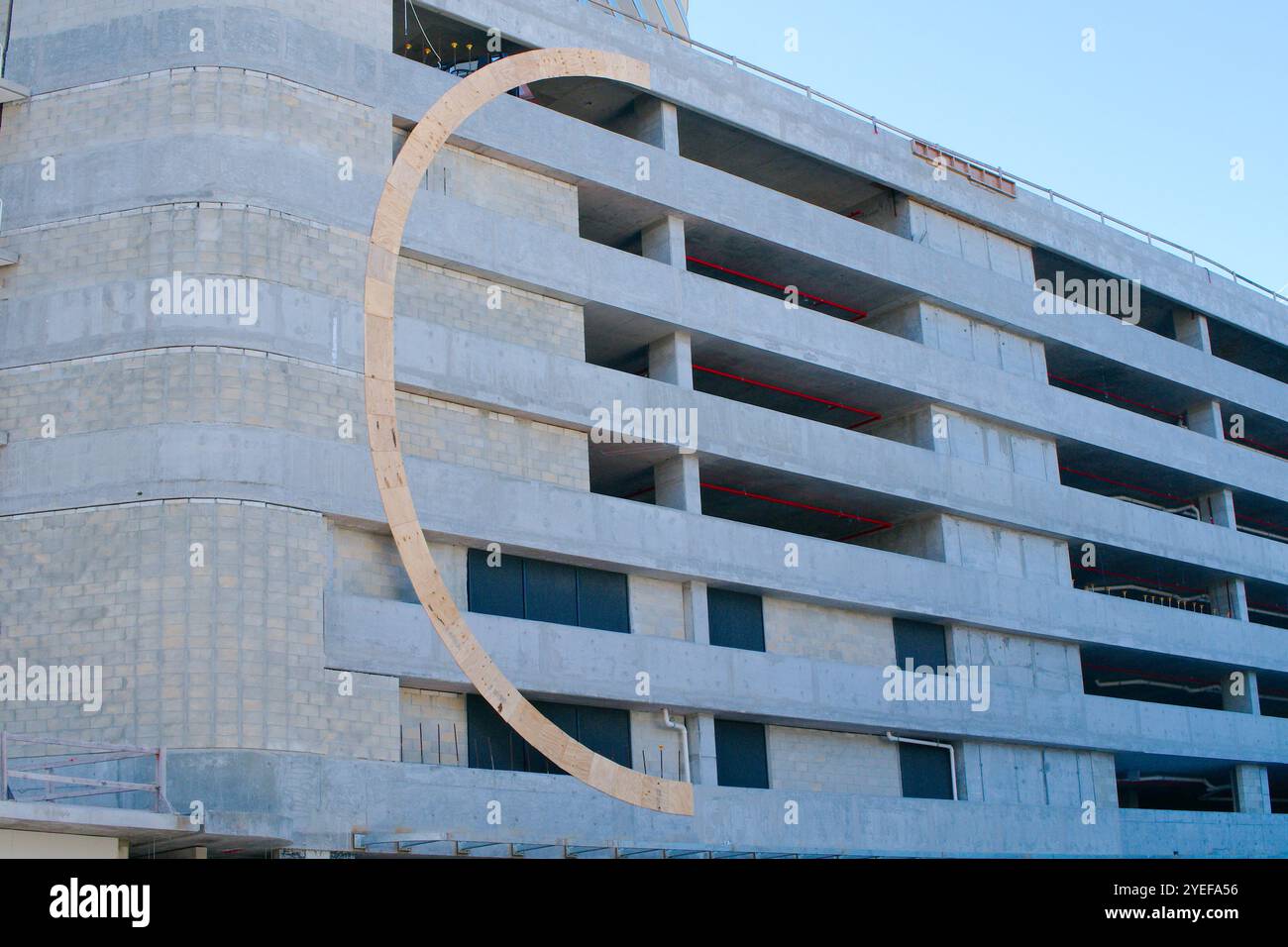 Multi story concrete Parking Garage under construction with a plywood ...