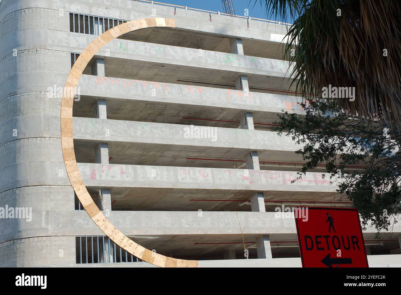 Multi story concrete Parking Garage under construction with a plywood ...