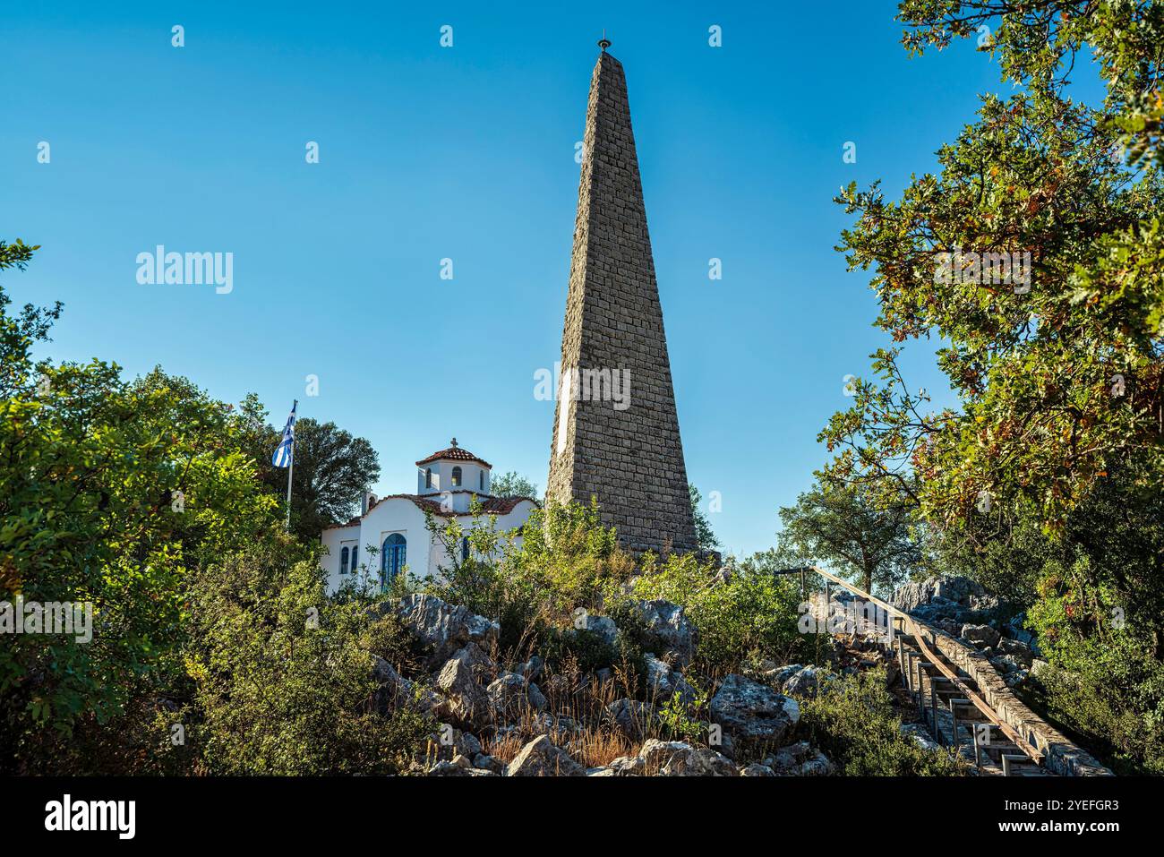 View of the Papaflessas monument and nearby white chapel in Maniaki ...