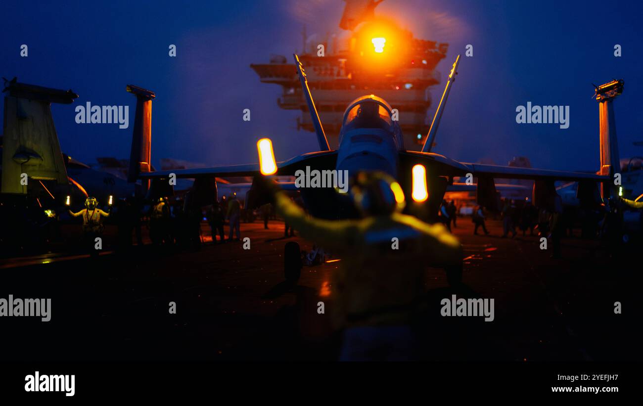 Lt. Albert Vencer, from Warren, Michigan, flight deck officer, directs ...