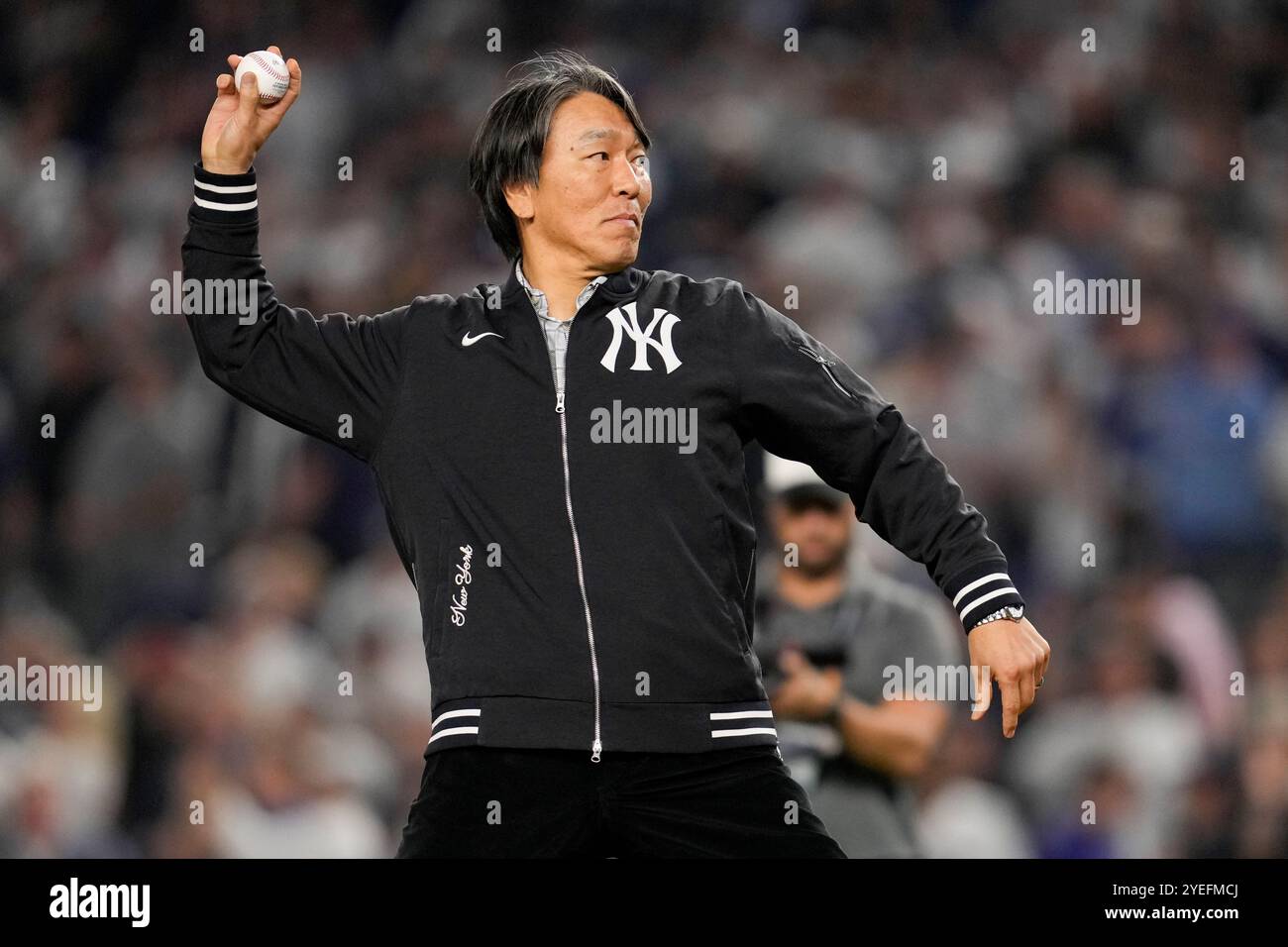 Former Yankee player, Hideki Matsui throws out the ceremony first pitch before Game 5 of the ...