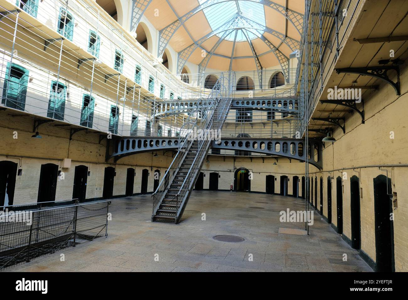 Main hall and metal stairway in Kilmainham Gaol prison, Dublin, Ireland ...
