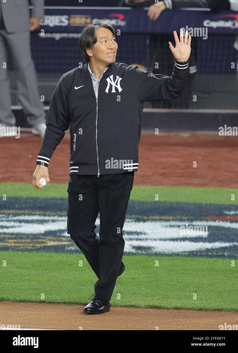 Hideki Matsui, nicknamed "Godzilla", throws out the ceremonial first pitch during a game of ...