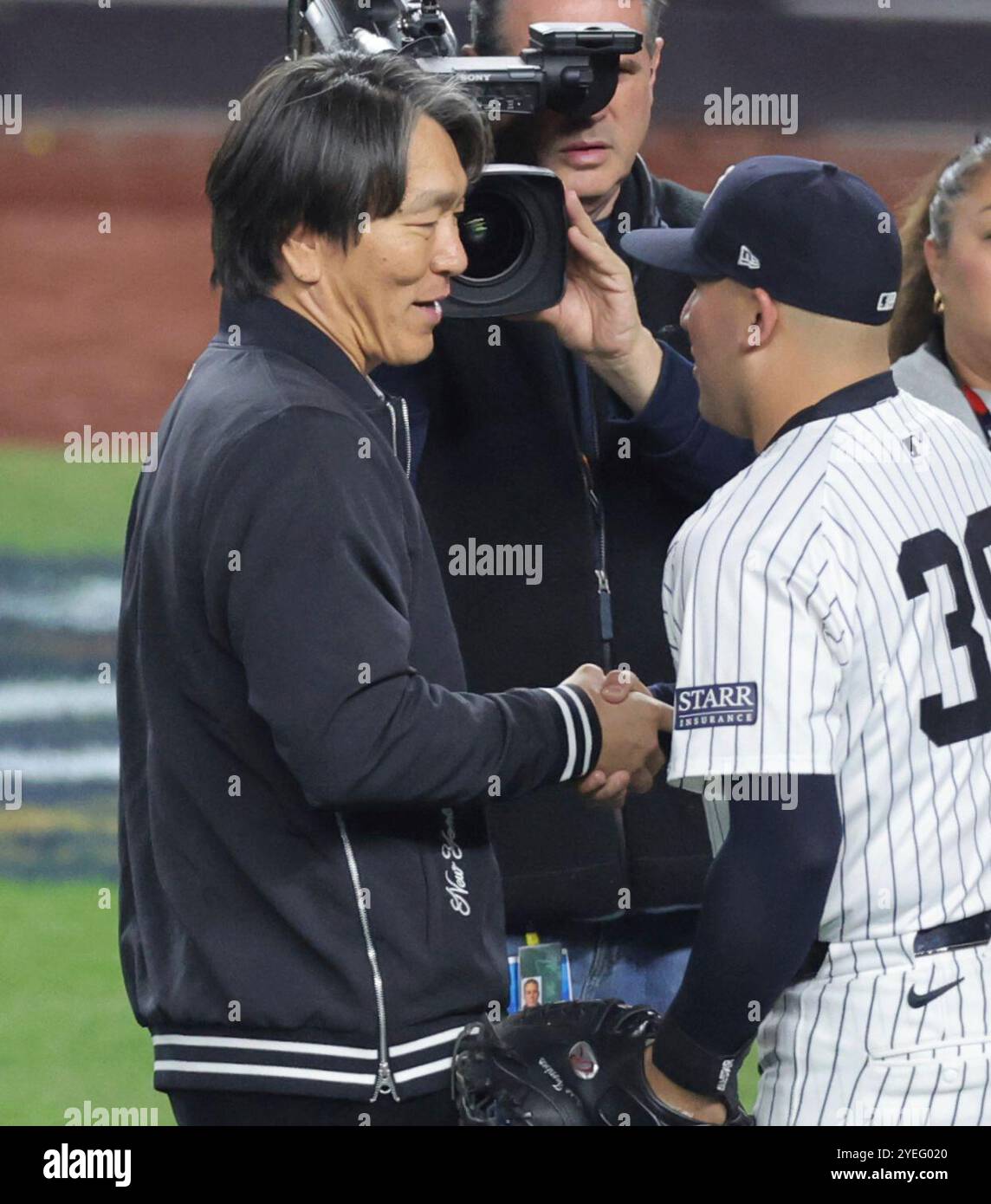 Hideki Matsui, nicknamed "Godzilla", throws out the ceremonial first ...