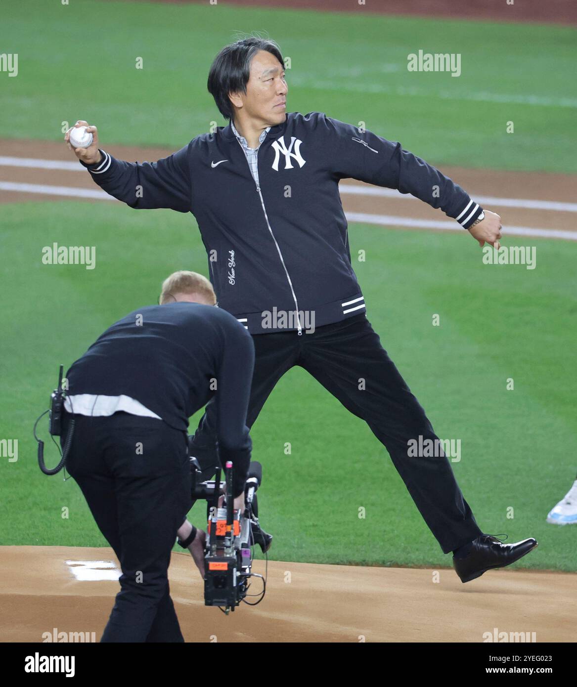 Hideki Matsui, nicknamed "Godzilla", throws out the ceremonial first pitch during a game of ...