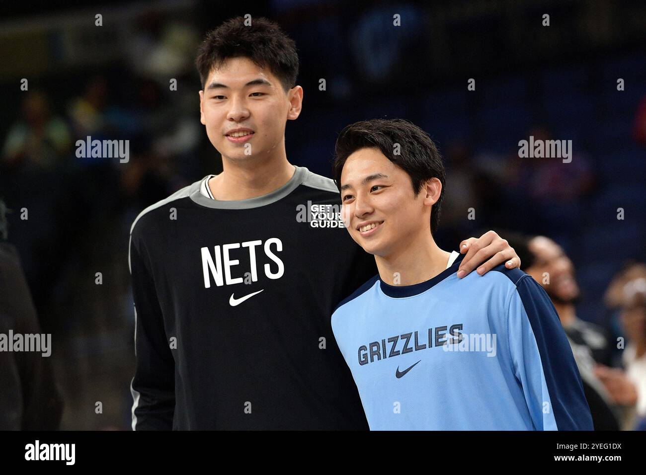 Brooklyn Nets guard Cui Yongxi, left, and Memphis Grizzlies guard Yuki ...