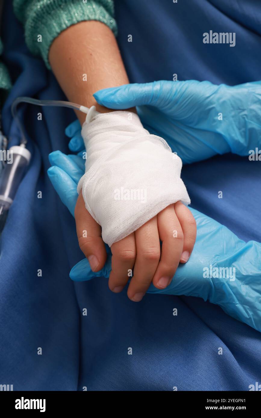 Doctor and child with IV drip in hospital, closeup Stock Photo - Alamy