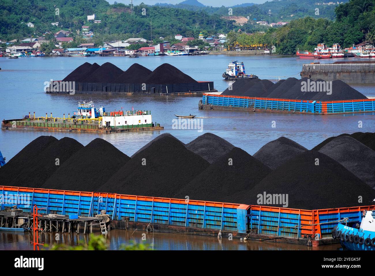 FILE- Barges fully loaded with coal are anchored on Mahakam river in ...