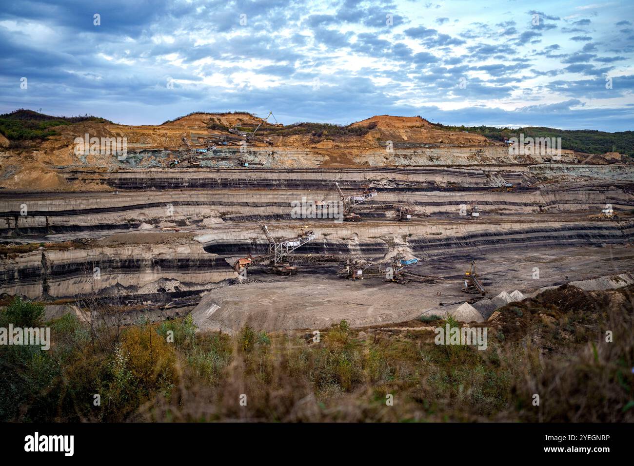 Coal extraction equipment operates at the open air quarry outside ...