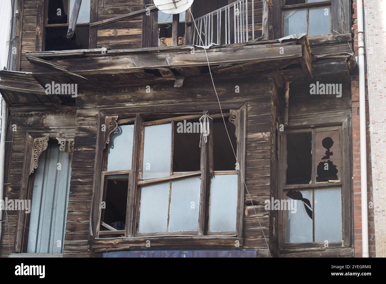 An Abandoned Building Featuring Broken Windows and Weathered Wood in a Derelict State Stock ...