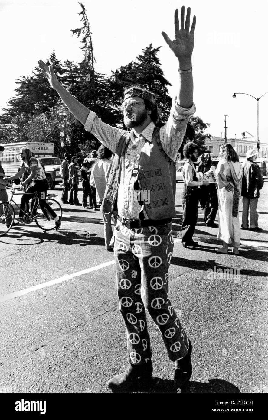 San Francisco, California: c. 1968 A tall hippie wearing peace symbols ...