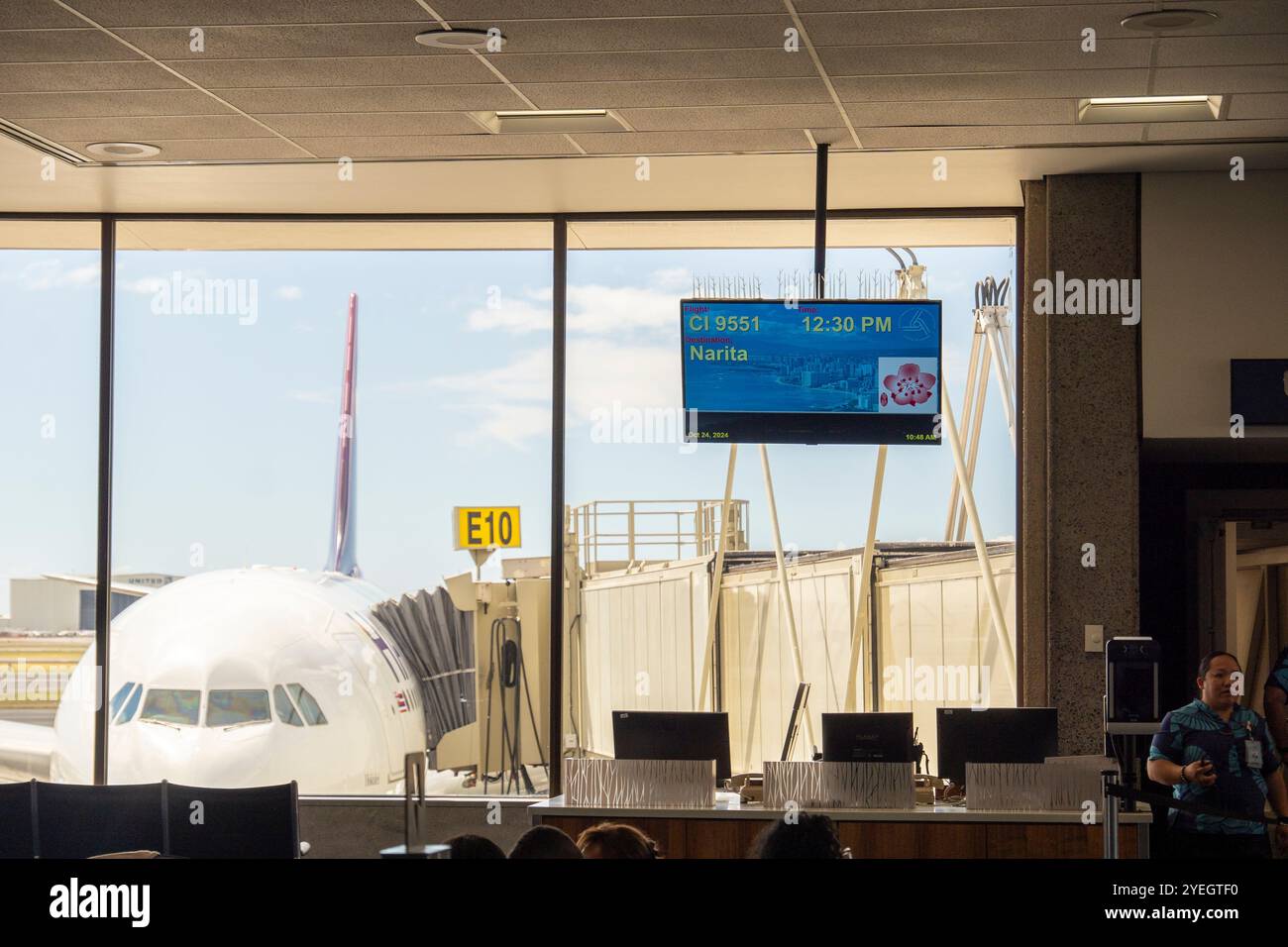 Flight departure at an airport terminal with a view of a jet and ...