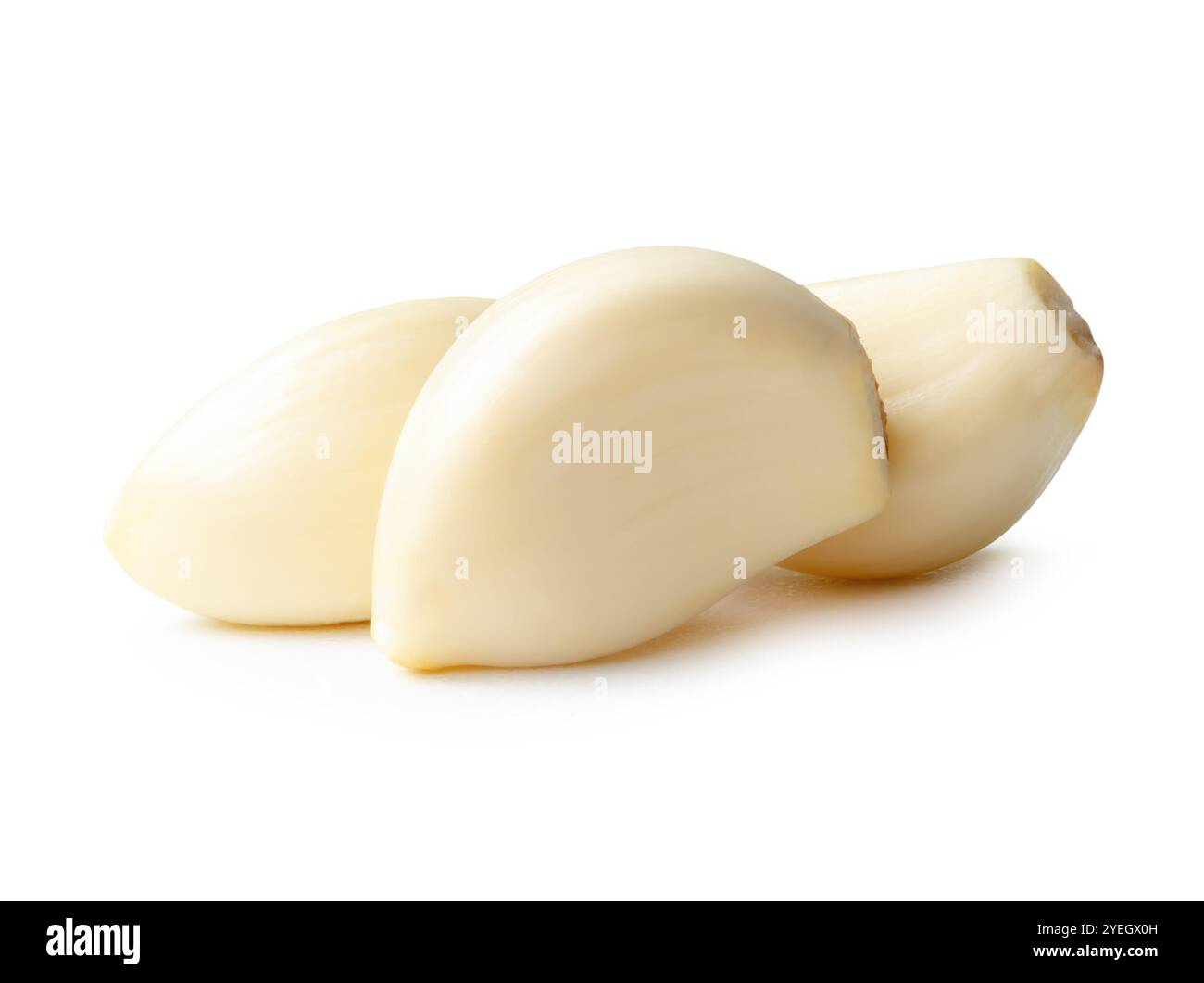 Side View Of Peeled Garlic Cloves In Stack Are Isolated On White