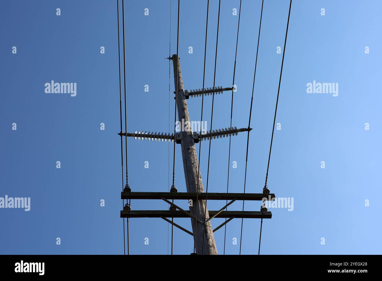 Electric power lines on wooden tower for conducting high voltage ...