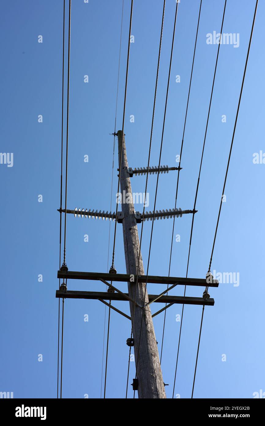 Electric power lines overhead vertical photo Stock Photo - Alamy