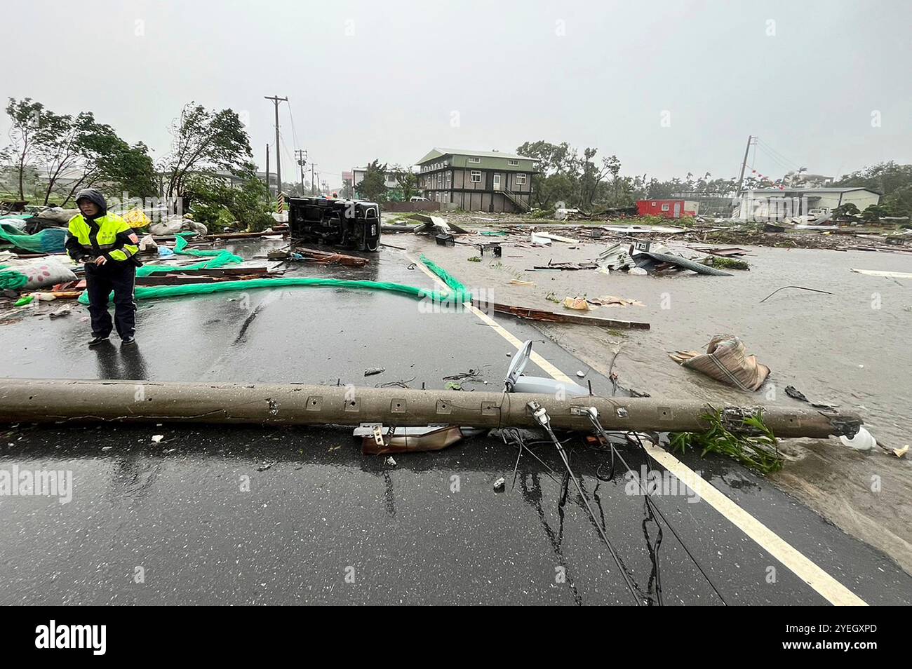 In this photo released by Hualien County Fire Department, police check ...