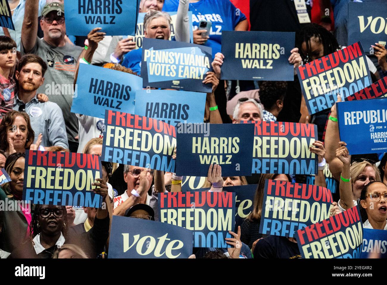 People holding up signs at a Get Out The Vote rally at the Pennsylvania ...