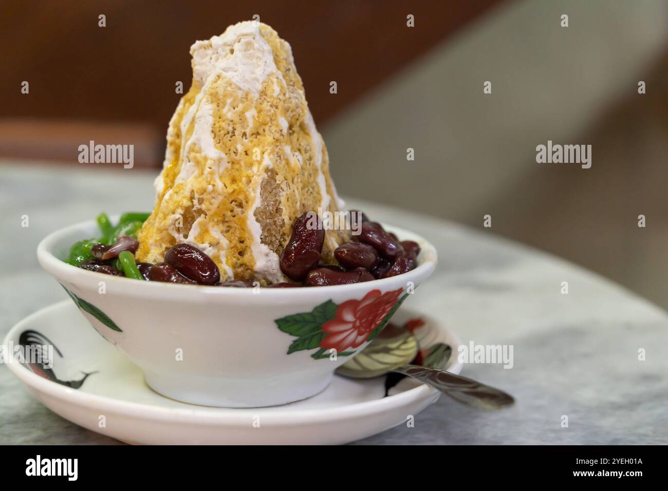 Close-up view of the cendol dessert with gula Melaka syrup. Cendol is ...