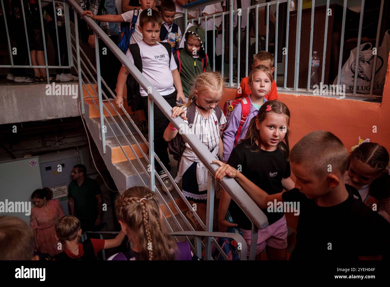 Children from Gymnasium No. 6 head to a basement set up with classrooms ...