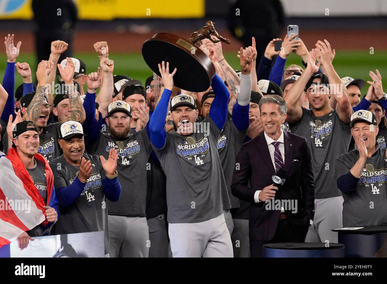 Los Angeles Dodgers' Freddie Freeman holds up the MVP trophy after the ...