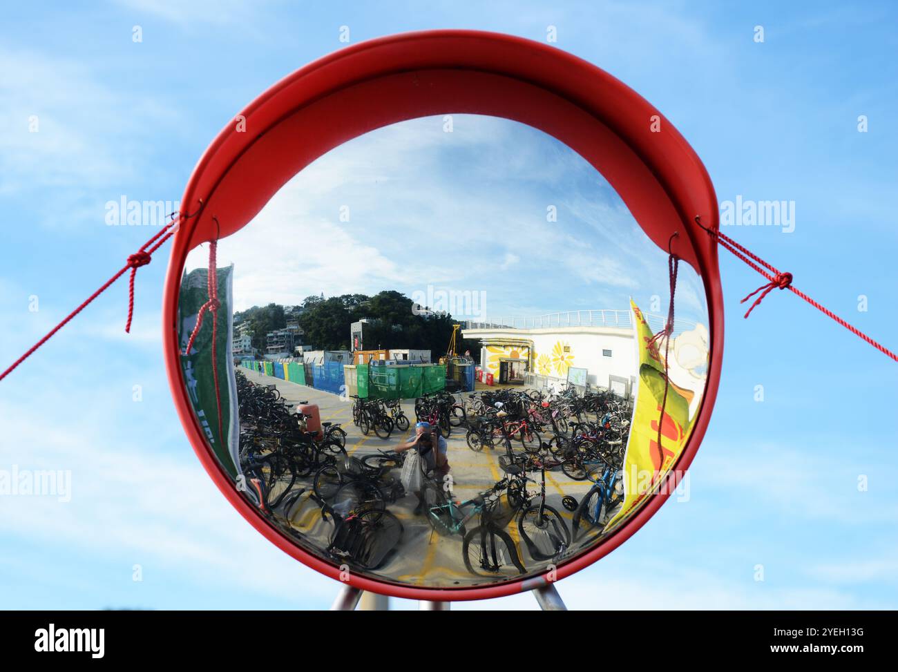 A convex traffic mirror at the new pier in Yung Shue Wan, Lamma Island ...