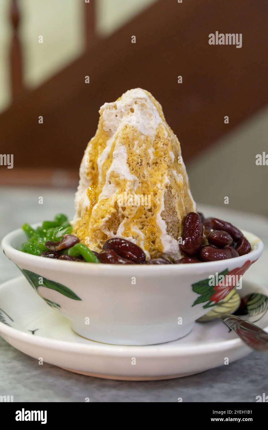 Close-up view of the cendol dessert with gula Melaka syrup. Cendol is ...