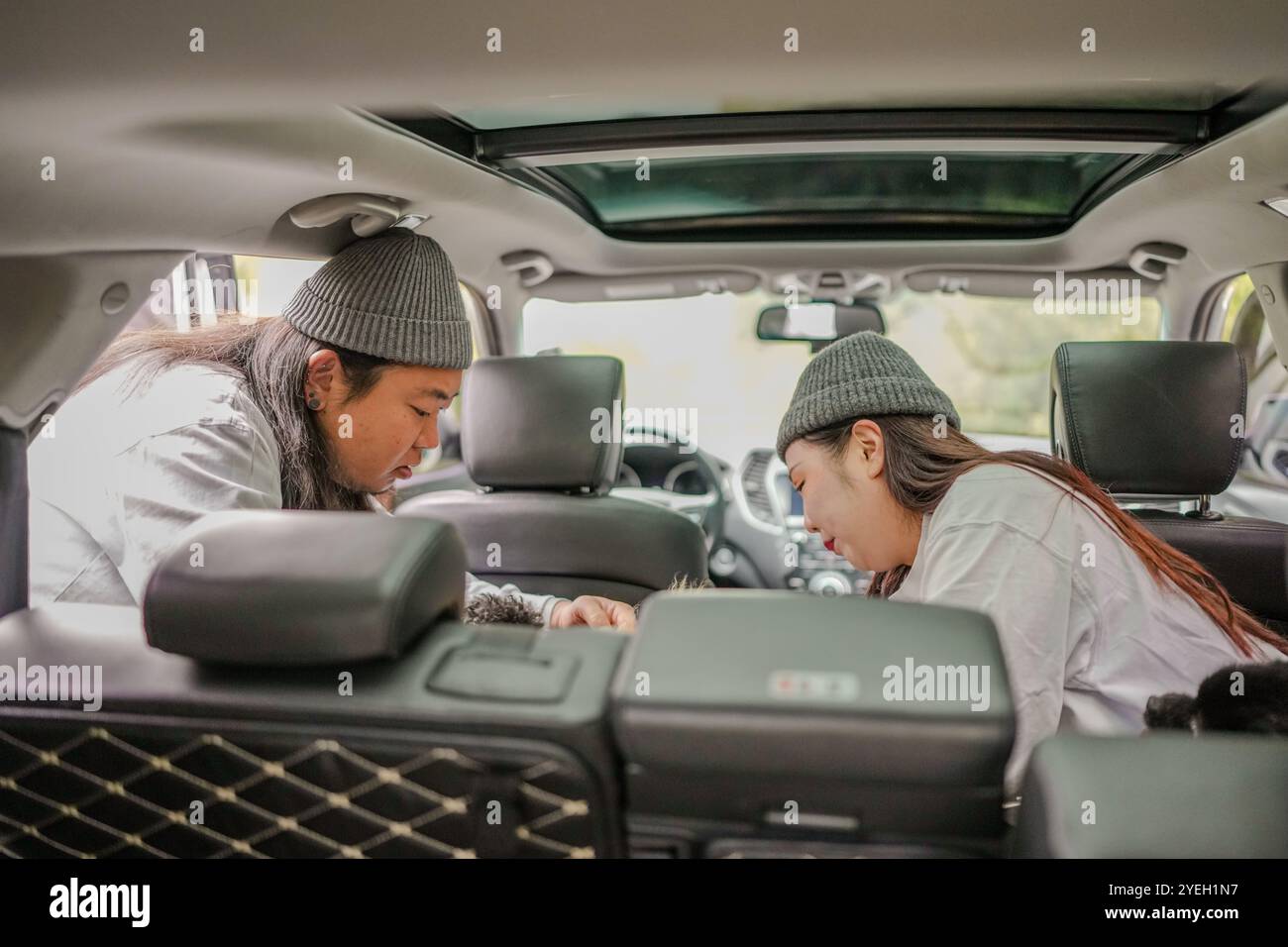 A Korean man in his 30s is driving a car in Pyeongnae-dong, Namyangju ...
