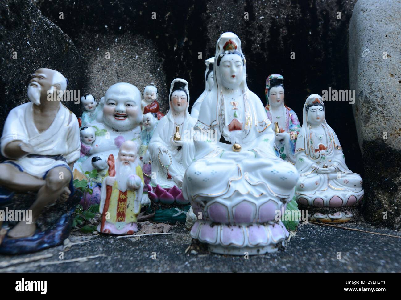 Small statues of religious figures at a small temple in Tai O village ...