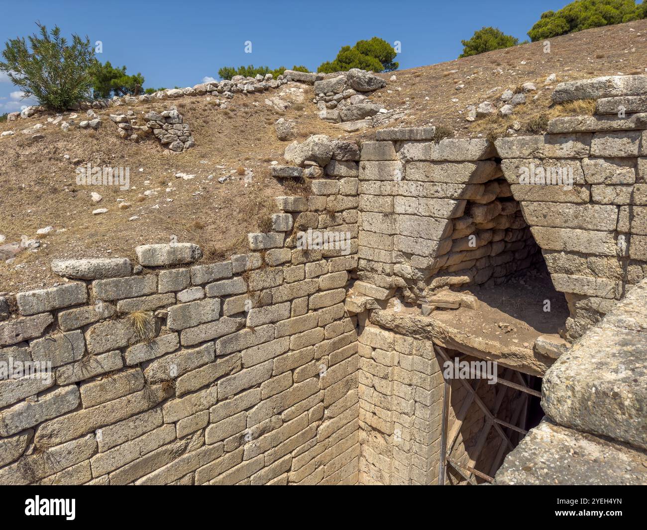 Tomb of Clytemnestra at the Mycenae archaeological site, Greece. Blue ...