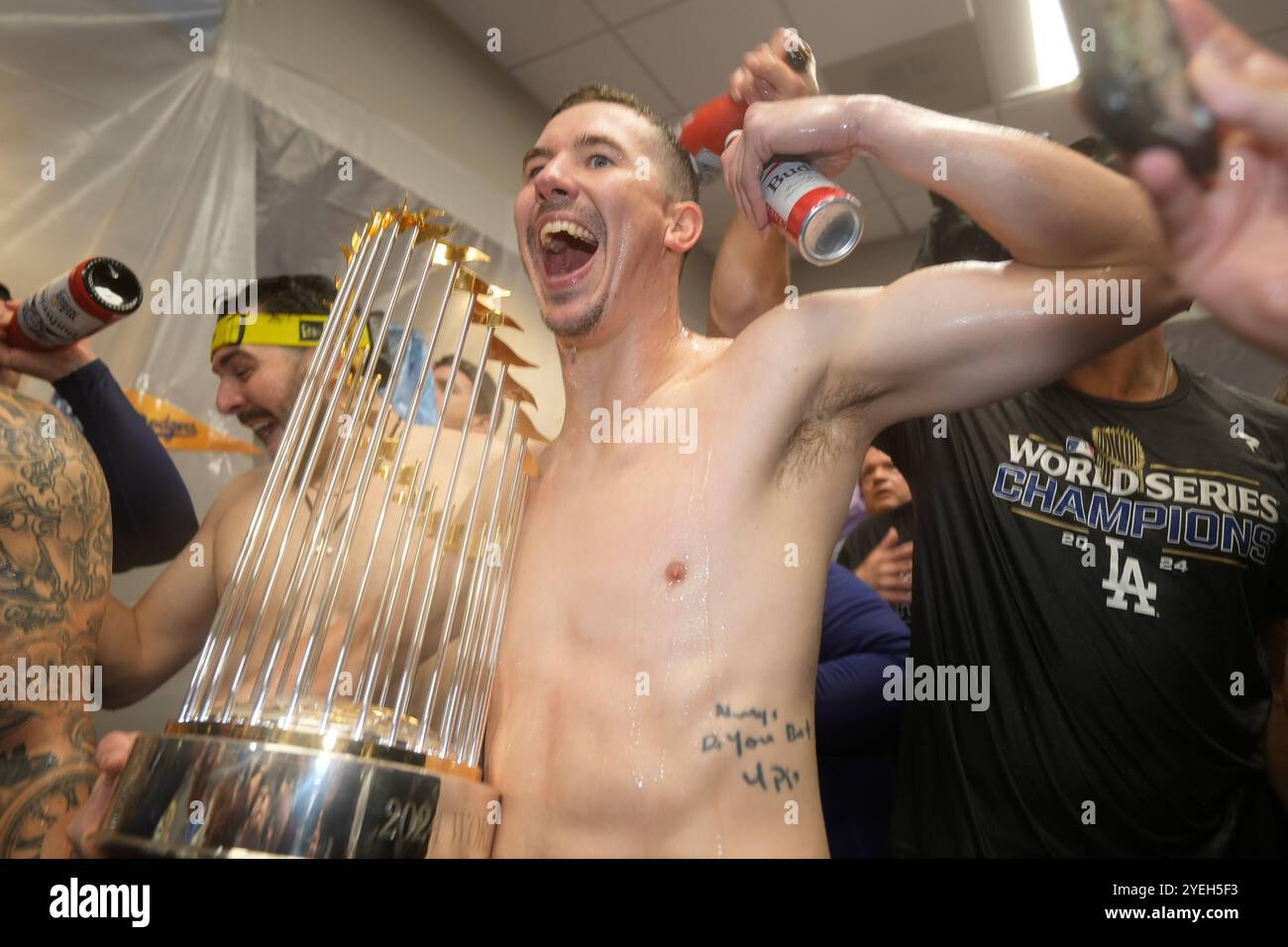 Los Angeles Dodgers pitcher Walker Buehler celebrates in the locker ...