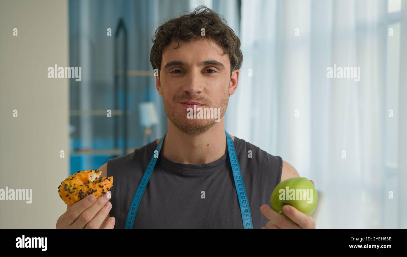 Happy man biting delicious donut hi-res stock photography and images ...