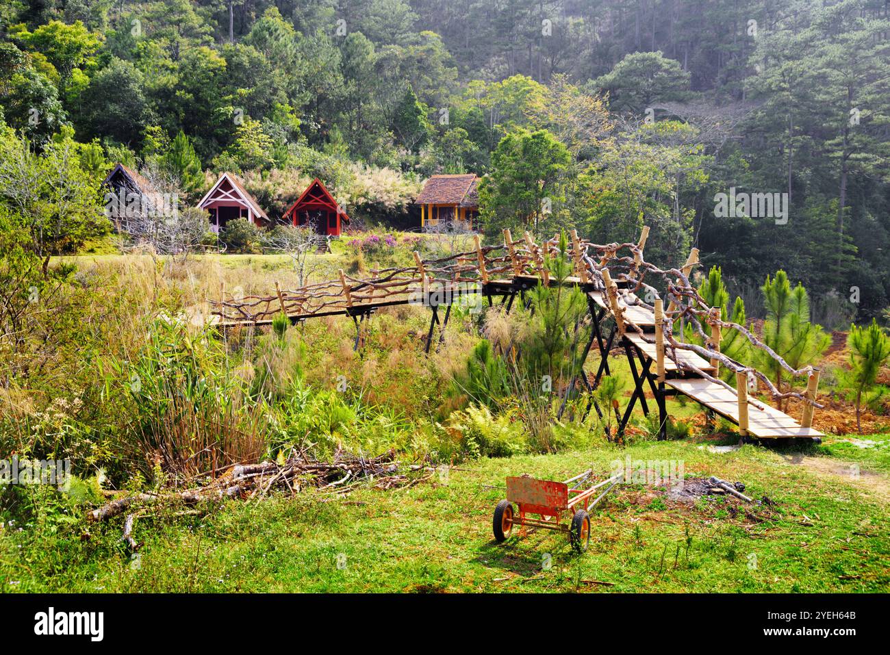 Amazing wooden bridge leading to scenic rustic houses Stock Photo - Alamy