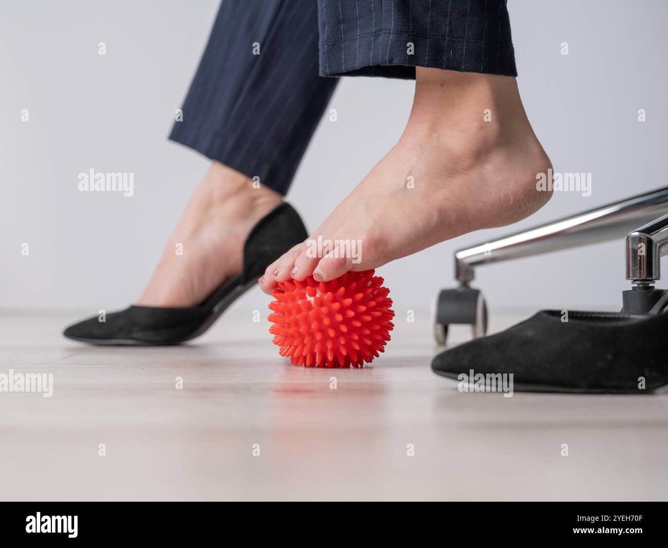 Business woman touching feet hi-res stock photography and images - Alamy
