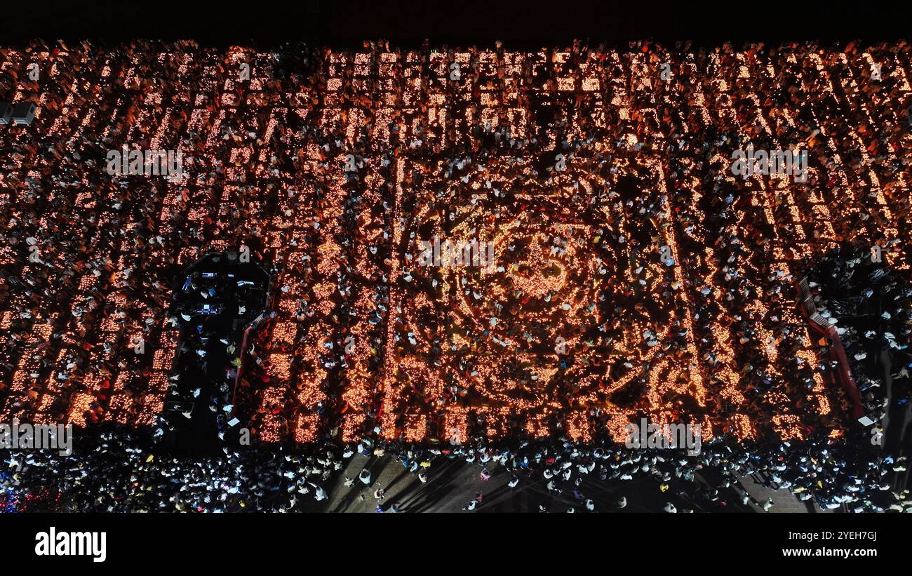 A record 2.51 million earthen oil lamps are lit along the Saryu river ...