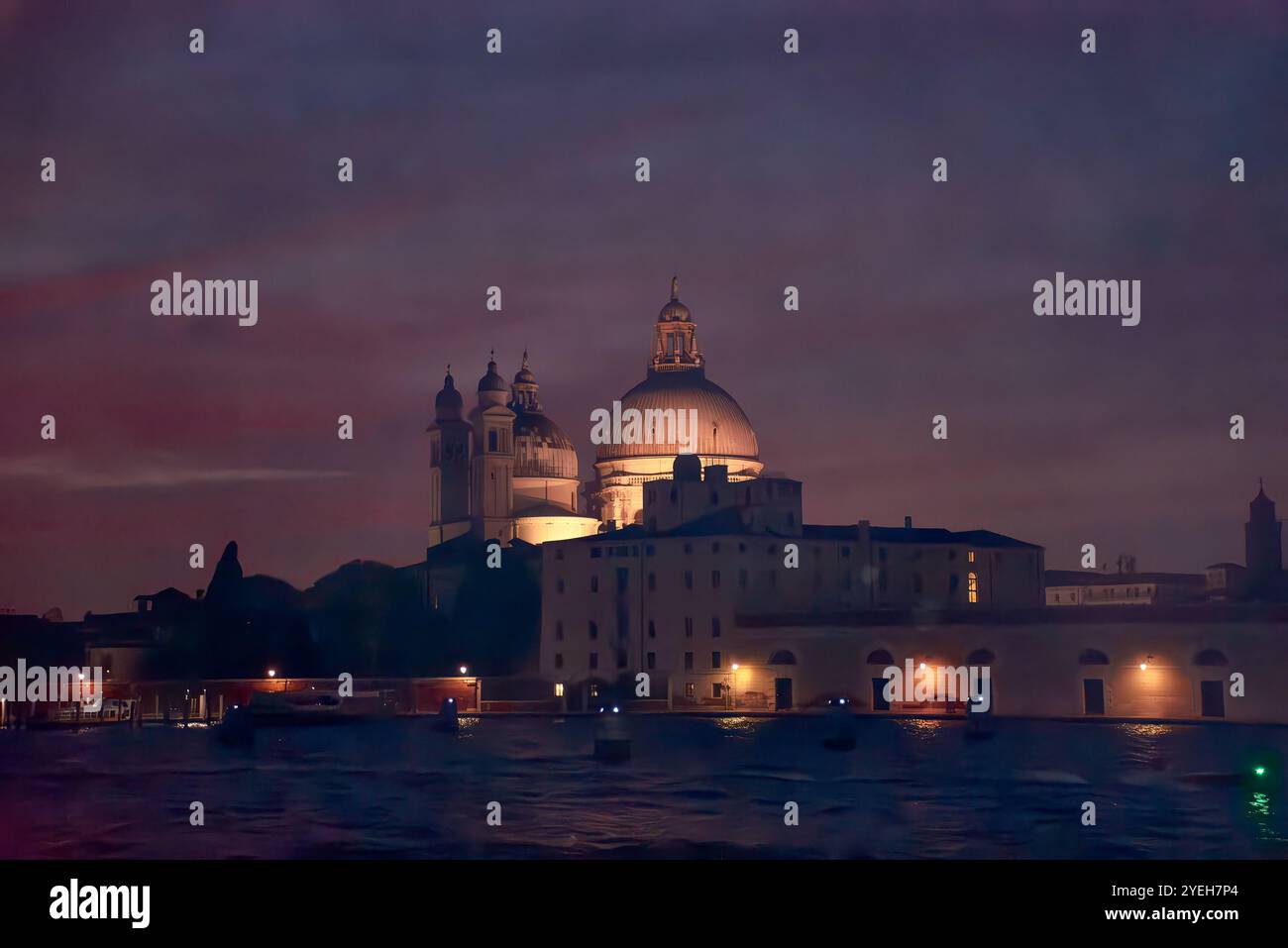 A breathtaking view of Venice at sunset. The city's iconic skyline is ...