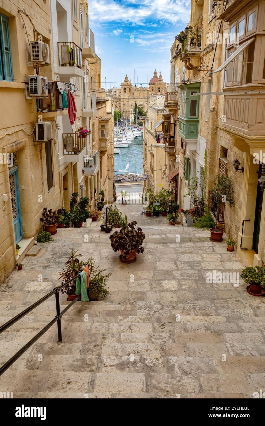 Narrow, street in Valletta, ancient core reveals historic sandstone ...