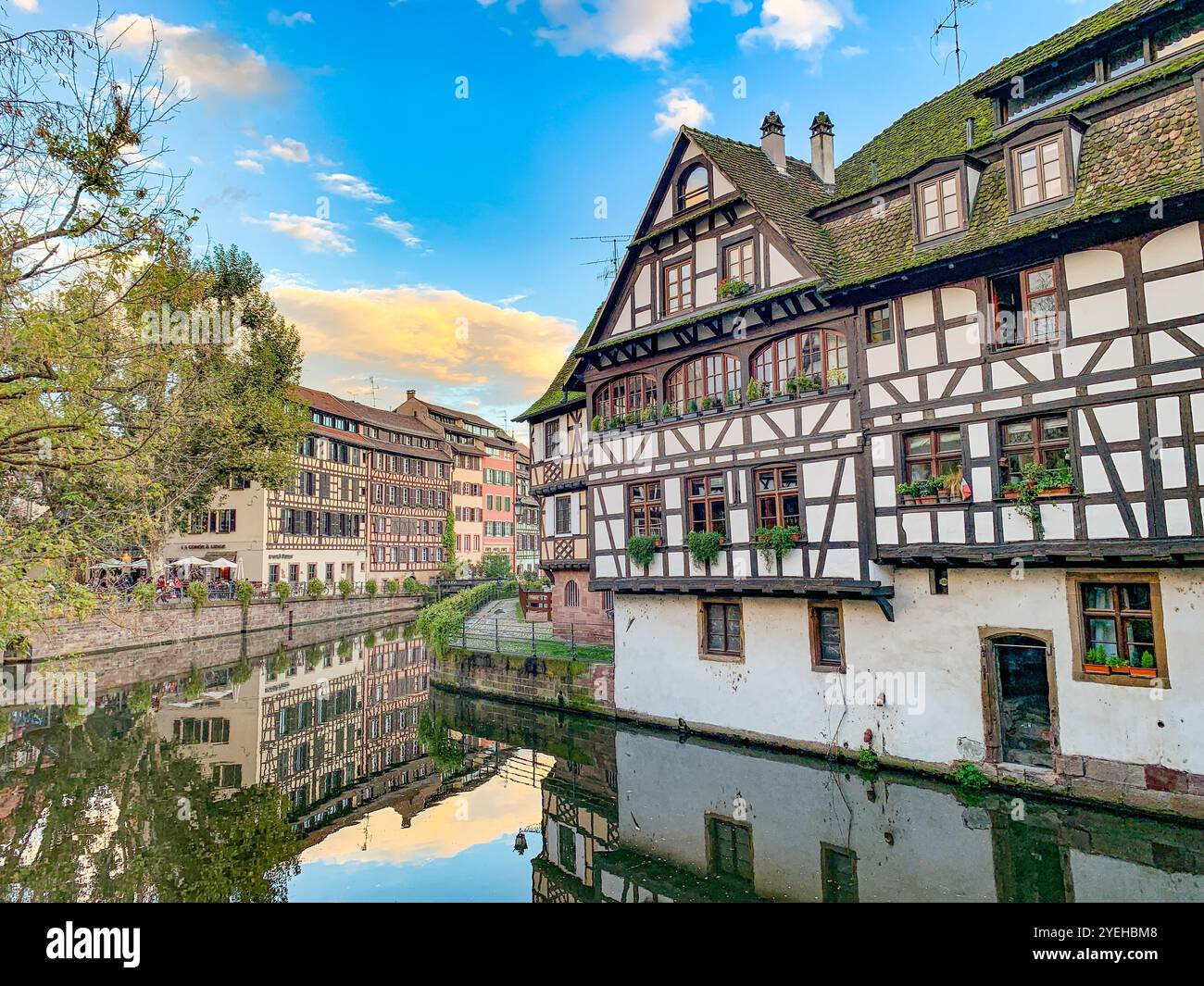 scenic historic half timbered house with reflection in the canals of ...