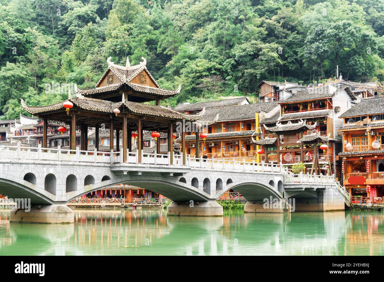 Bridge and traditional Chinese riverside buildings, Fenghuang Stock ...
