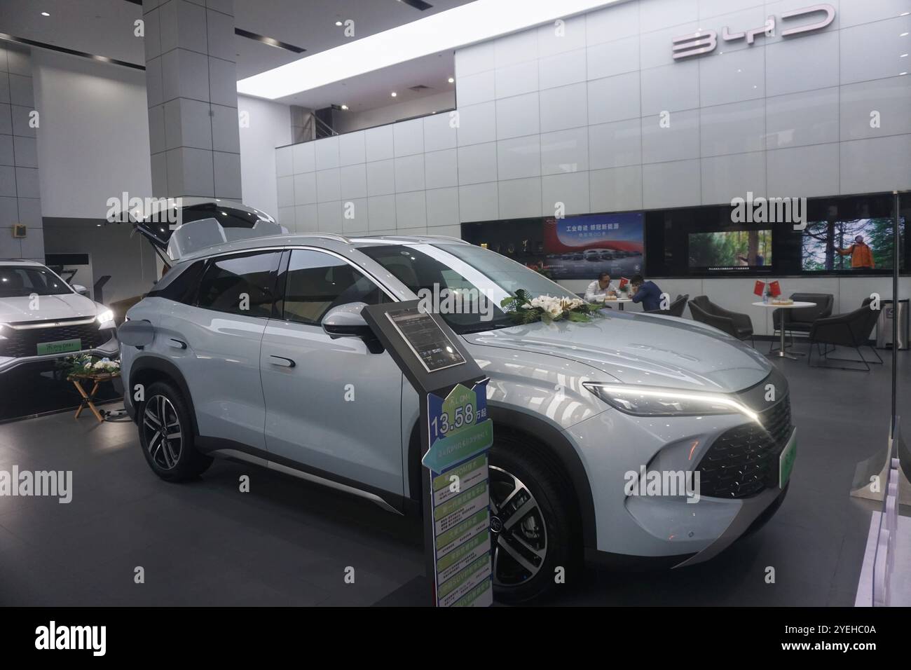 HANGZHOU, CHINA - OCTOBER 31, 2024 - Customers buy a BYD electric car ...
