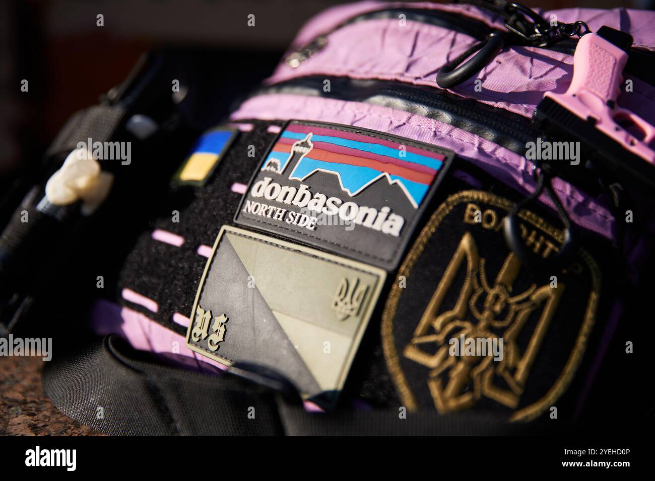 Patch "Donbasonia" on bag of Ukrainian activist. Kyiv - 27 October,2024 ...