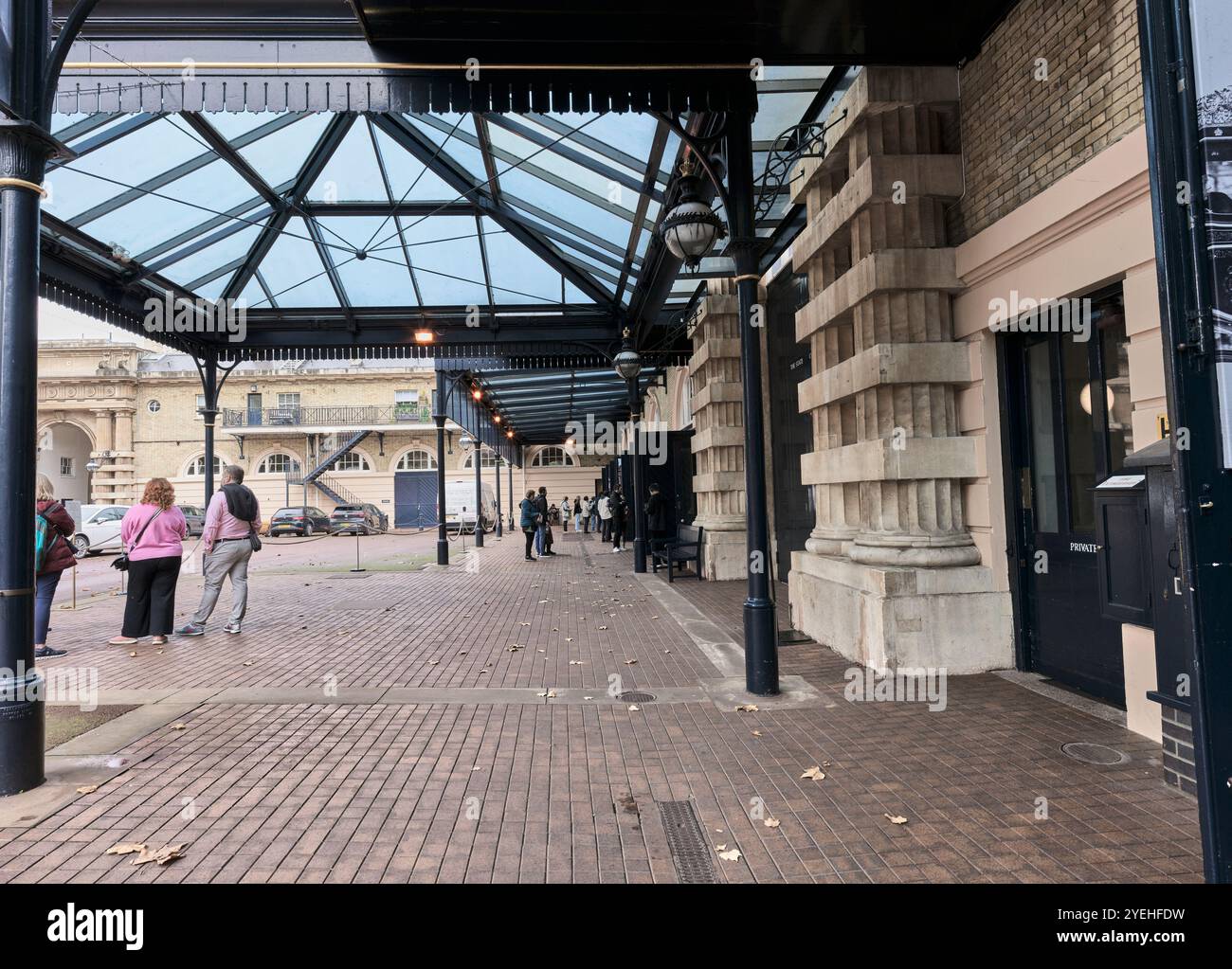Visitors in the courtyard of The Royal Mews, Buckingham Palace, London ...