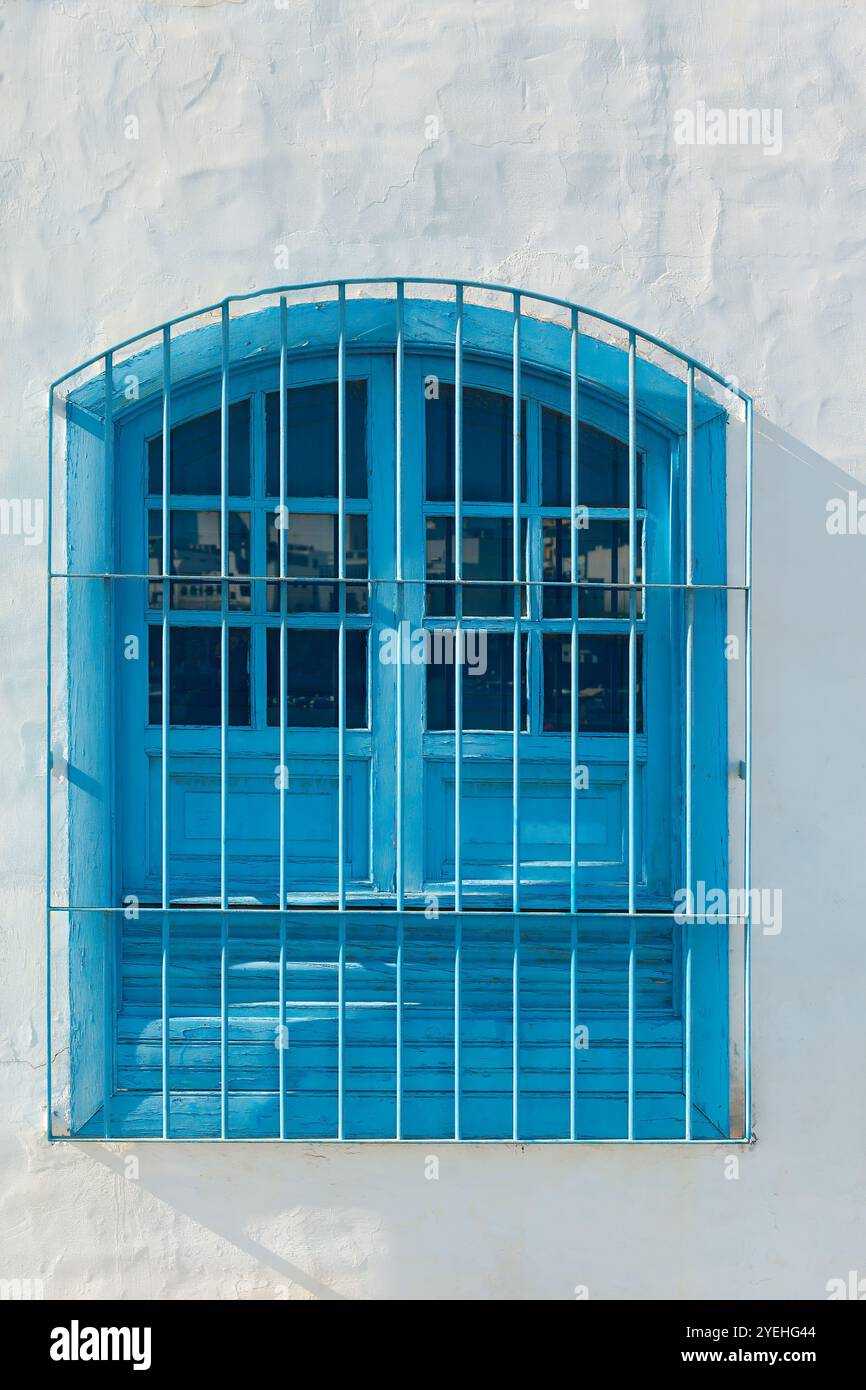 Blue window with metal bars, showing a secure and stylish architectural ...