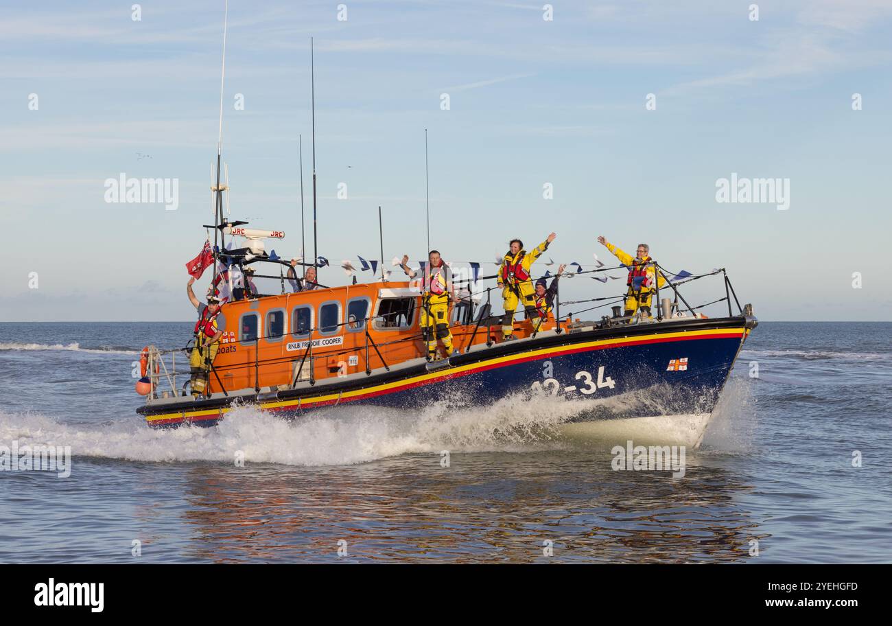 The crew of the Aldeburgh Lifeboat waving to the crowds on the beach ...