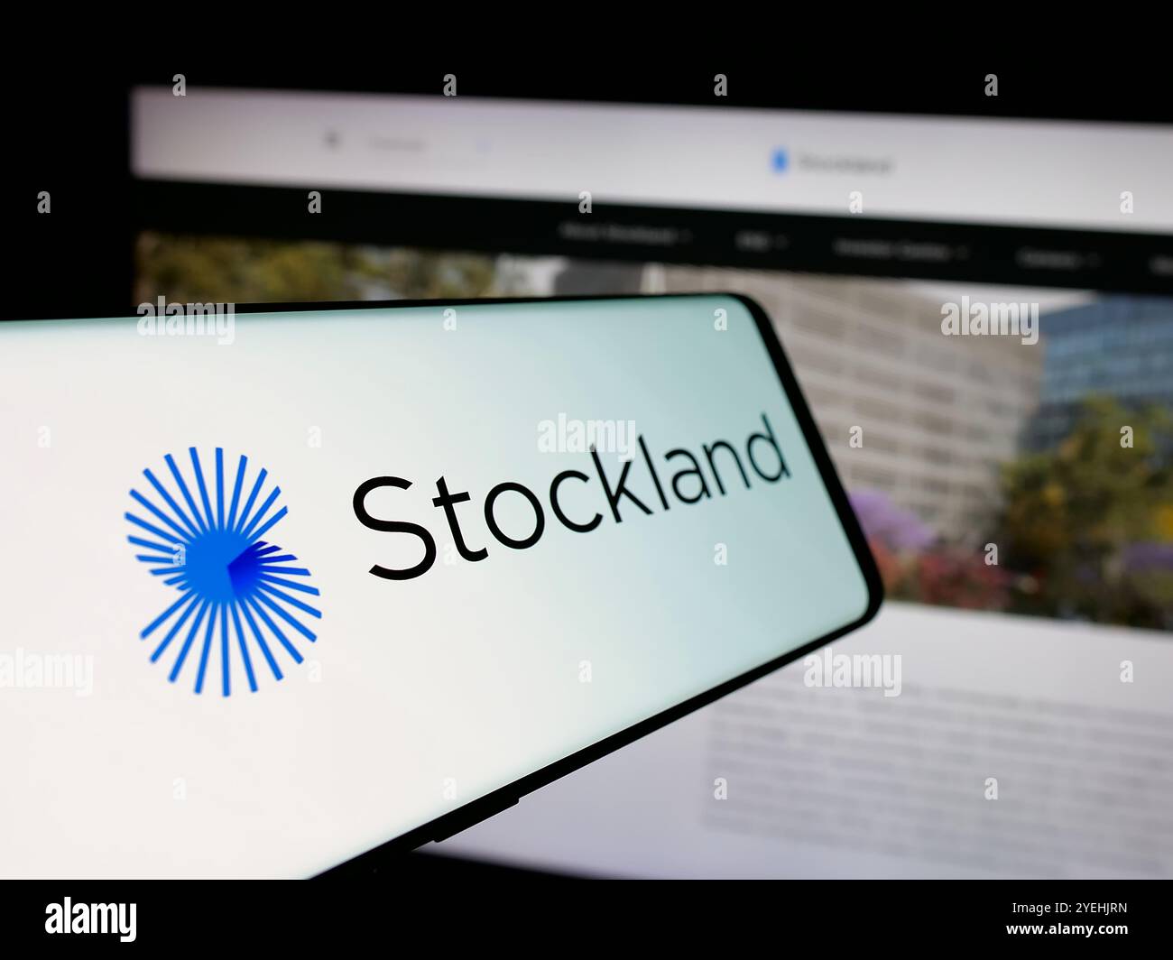 Smartphone with logo of Australian company Stockland Corporation ...